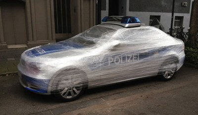 Artist Wraps Police Cars In Plastic Film And Calls It Art